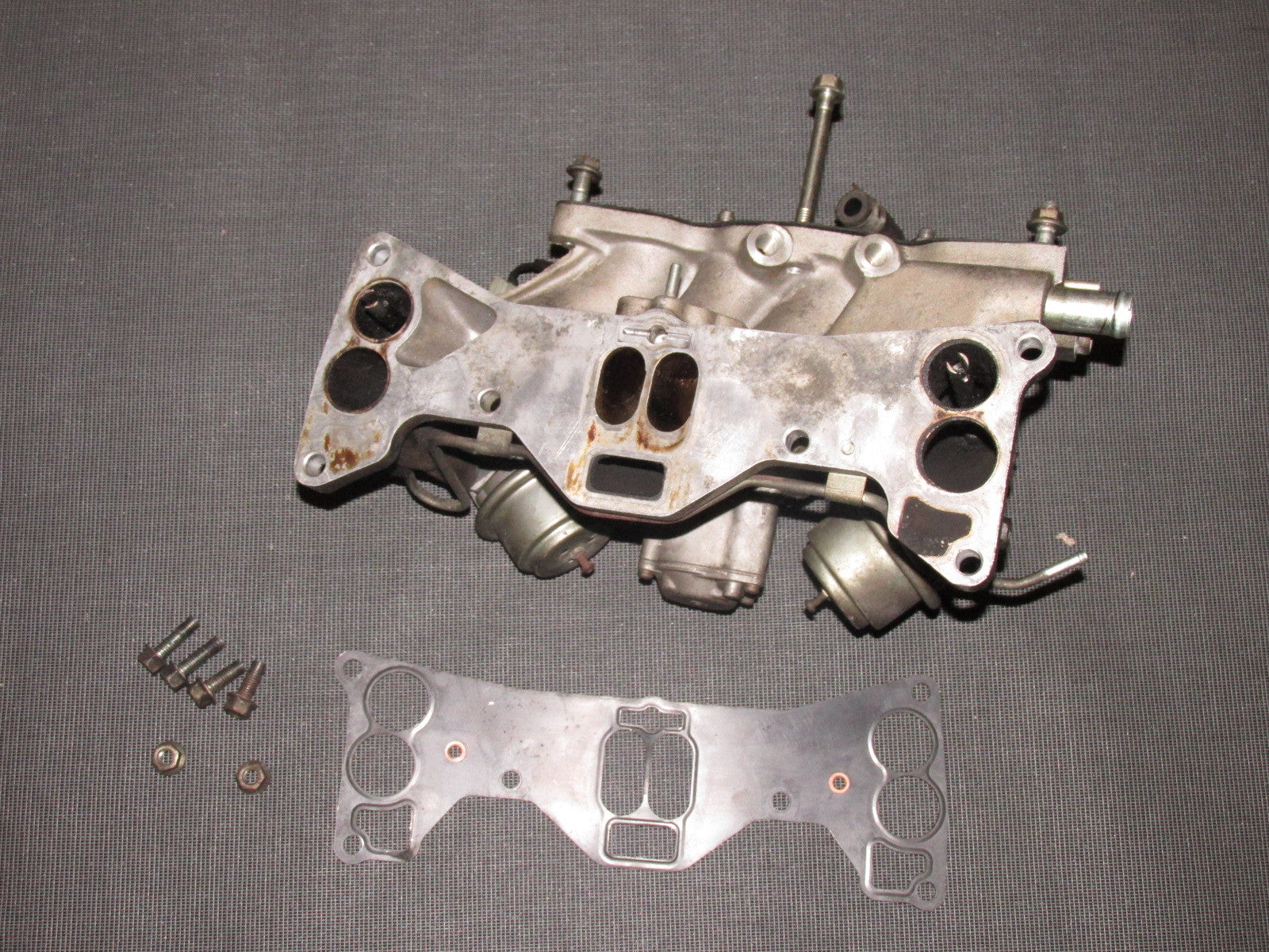 84 85 Mazda RX7 OEM 13B Lower Intake Manifold Assembly – Autopartone.com